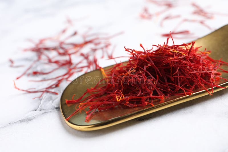 Dried Saffron on White Marble Table, Closeup Stock Image - Image of ...