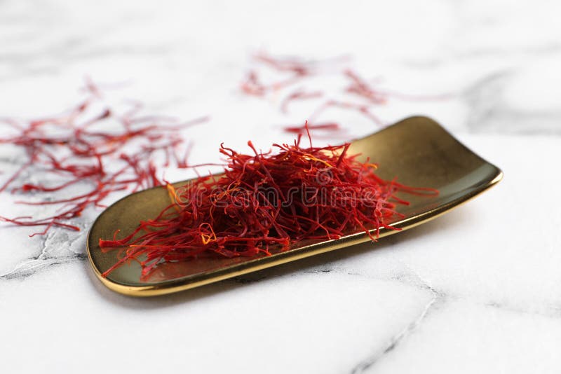 Dried Saffron on White Marble Table, Closeup Stock Image - Image of ...