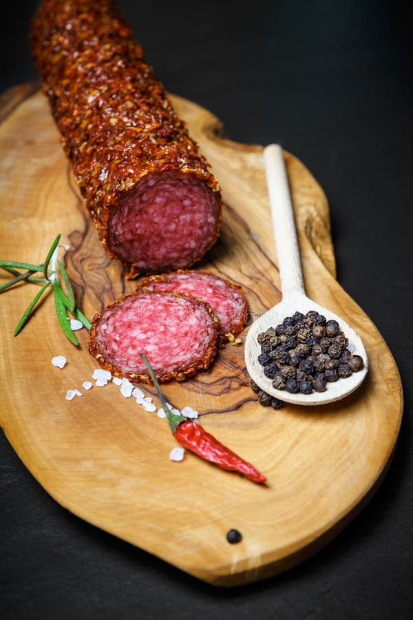 Dried Salami Crusted in Ground Red Pepper Stock Image - Image of deck ...