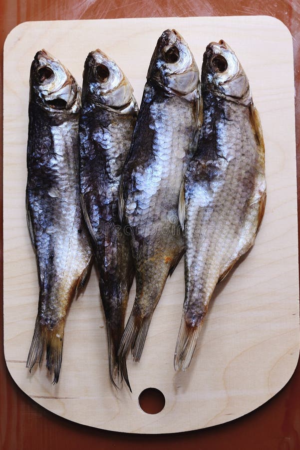 Dried Salted Fish on a Cutting Board Stock Photo - Image of group ...