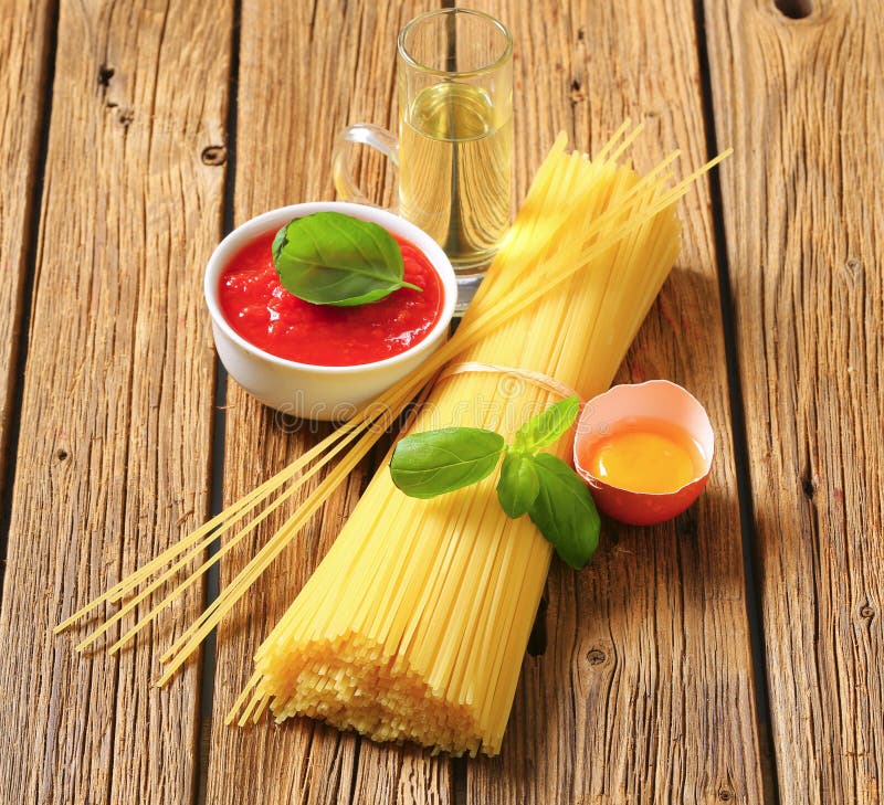 Dried Spaghetti and Tomato Puree Stock Image - Image of basil, uncooked ...
