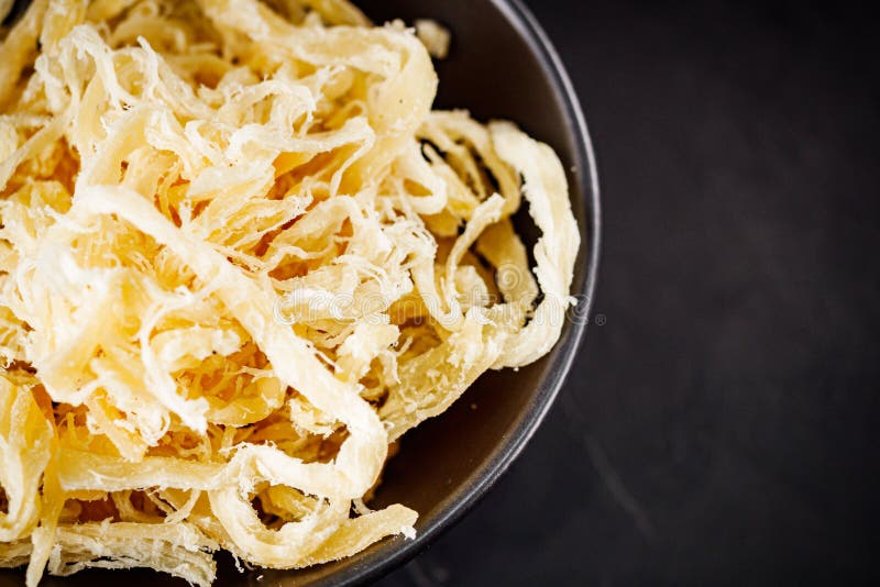 Dried Squid Meat on a Dark Stone Background Stock Photo - Image of dark ...