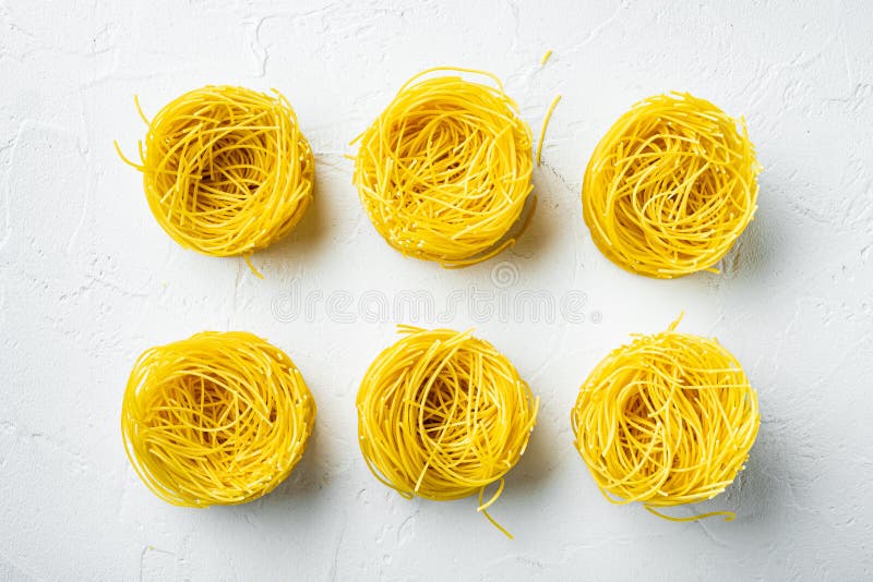 Dried Taglierini , on White Stone Surface, Top View Flat Lay Stock ...