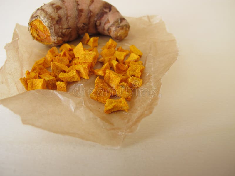 Dried Turmeric in Wax Paper Stock Photo - Image of healthy, golden ...