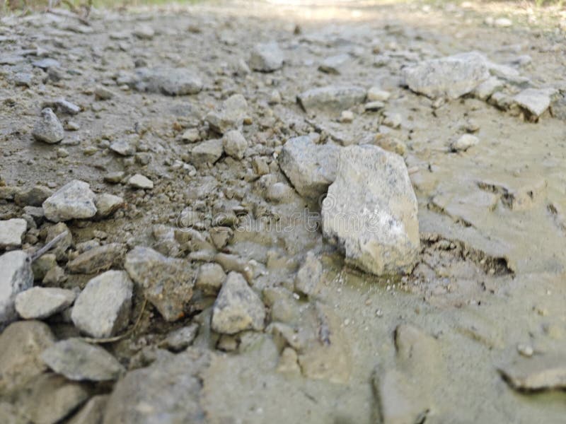 Dried Up Puddle Left with Stones Along the Pathway Stock Photo - Image ...
