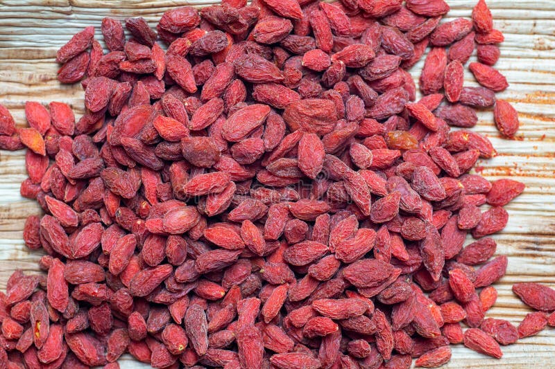 Dried Wolfberries on a Rustic Wooden Plate. a Bunch of Goji Berries ...
