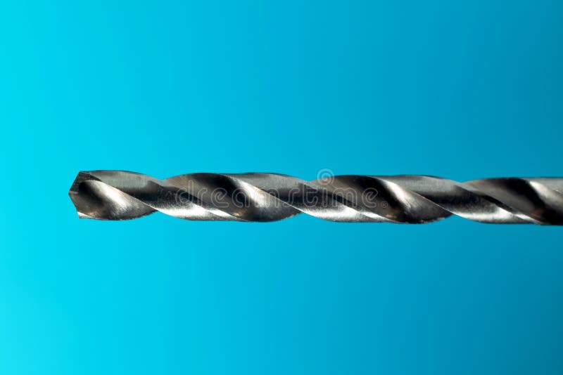 Drill Bit Close Up on Blue Background Stock Photo - Image of drilling ...