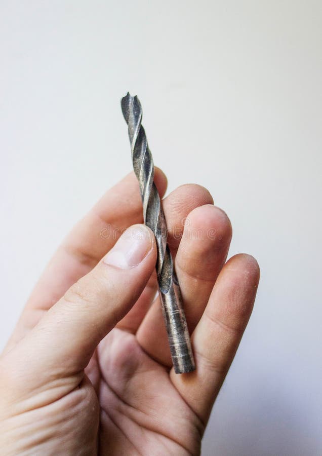 Drill bit in hand stock photo. Image of improvement, dust - 96208900
