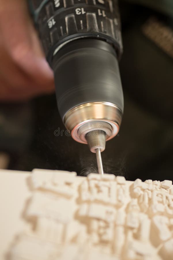 Drill Bit Perforating Hole on Plaster Model Stock Photo - Image of ...
