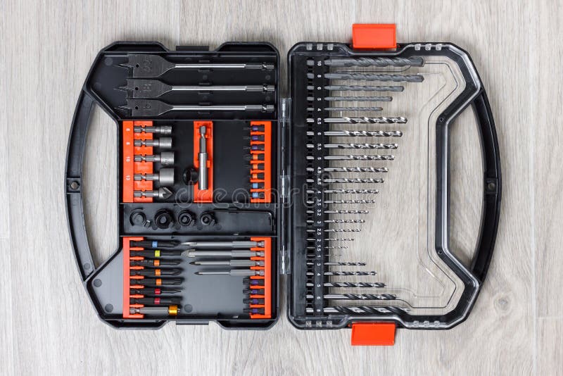 Drill Bit Set in a Black Plastic Case on a Wooden Floor. Stock Image ...