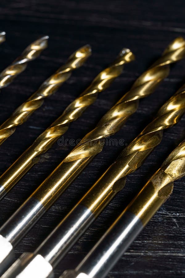 Drill bits on table stock image. Image of tool, cutter - 331553967