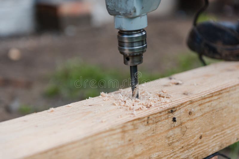 Drill a Hole in the Board. Drill a Hole in the Timber Stock Image ...