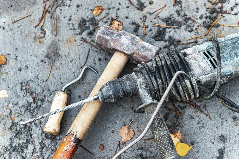 Drill or Perforator and Construction Tool on a Concrete Surface. Hand ...