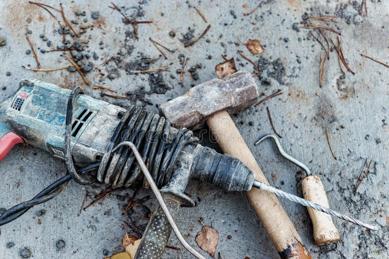 Drill or Perforator and Construction Tool on a Concrete Surface. Hand ...
