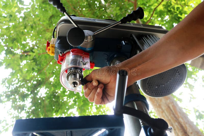 Drill Presses Machine with Machinist. Stock Photo - Image of machinist ...