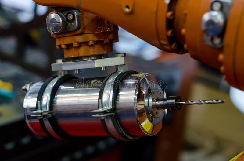 Drill on robot arm stock photo. Image of machinery, industry - 141110378
