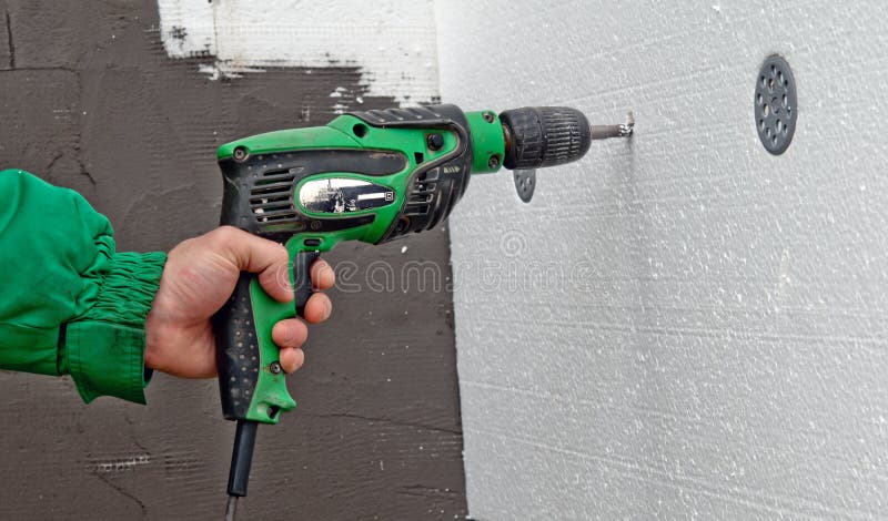 Drill the wall stock image. Image of professional, power - 35273303