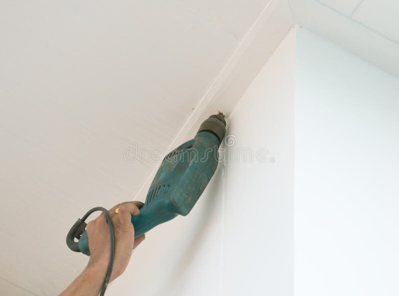 Drilling a Ceiling with Electric Drill Stock Photo - Image of smoke ...