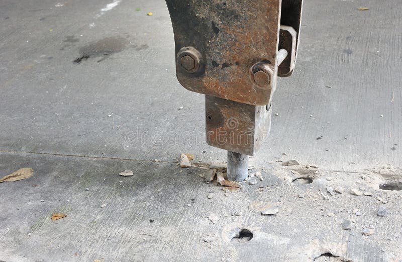 Drilling the Concrete Road by Excavator Digging Machine Stock Photo ...