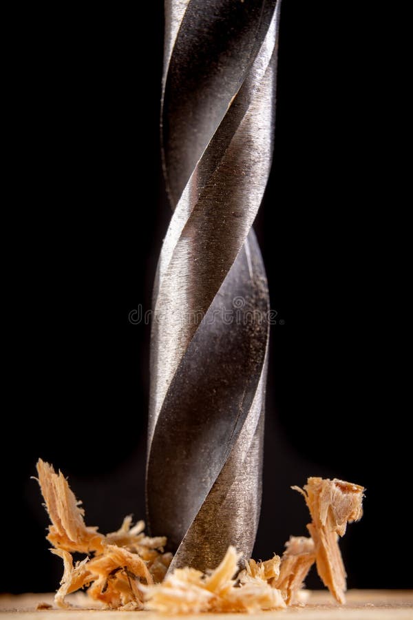 Drilling with a Drill Bit into Wood. Small Carpentry Work in a ...