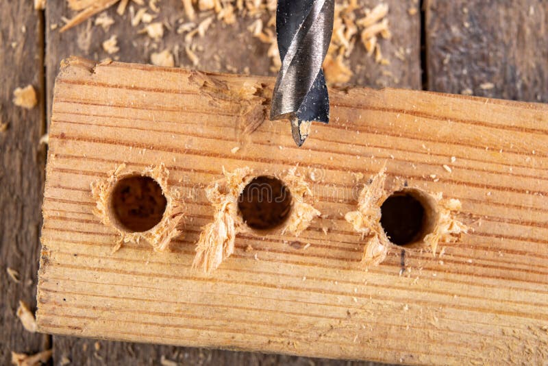 Drilling with a Drill Bit into Wood. Small Carpentry Work in a ...
