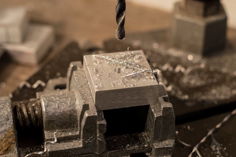 Drilling into a Block of Metal Stock Photo - Image of strength ...