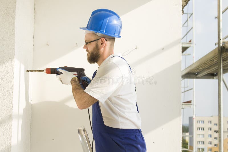 Drilling the Hole with a Drill in the Wall. Stock Image - Image of ...