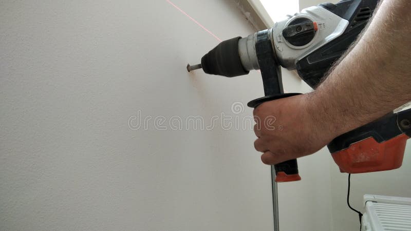 Drilling a Hole with a Drill in the Wall Wit Stock Image - Image of ...