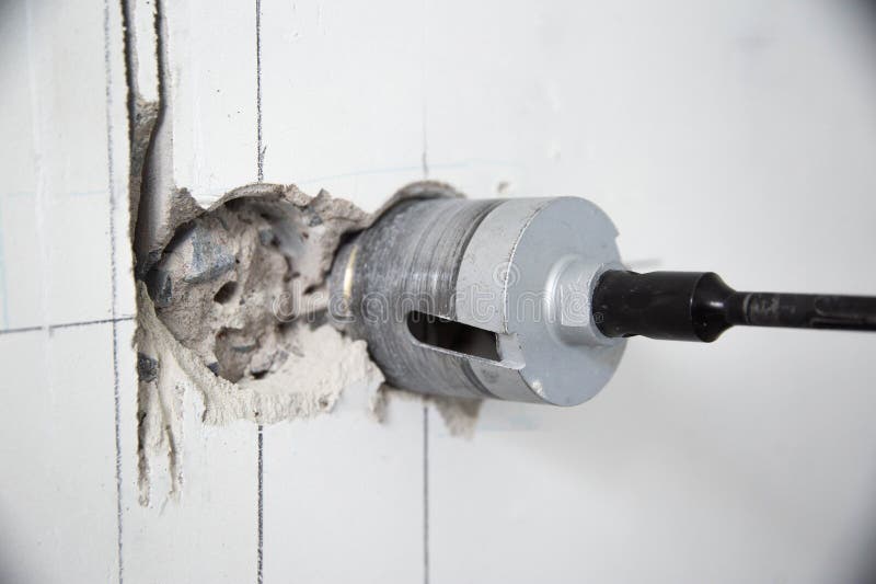 Drilling Holes in a Concrete Wall for Socket Boxes with a Diamond Core ...