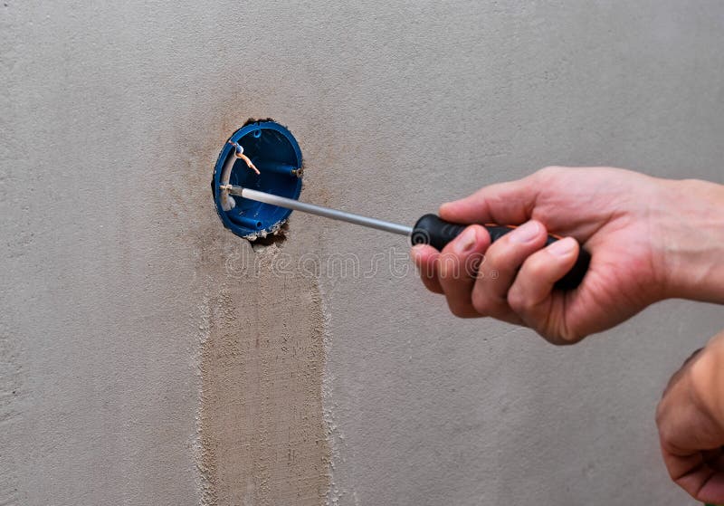 Drilling and Installing Plastic Blue Boxes for Fixing New Sockets by ...