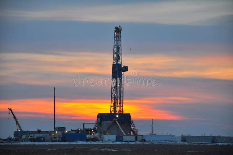 The Drilling Rig during Sunset Stock Photo - Image of oilfield ...