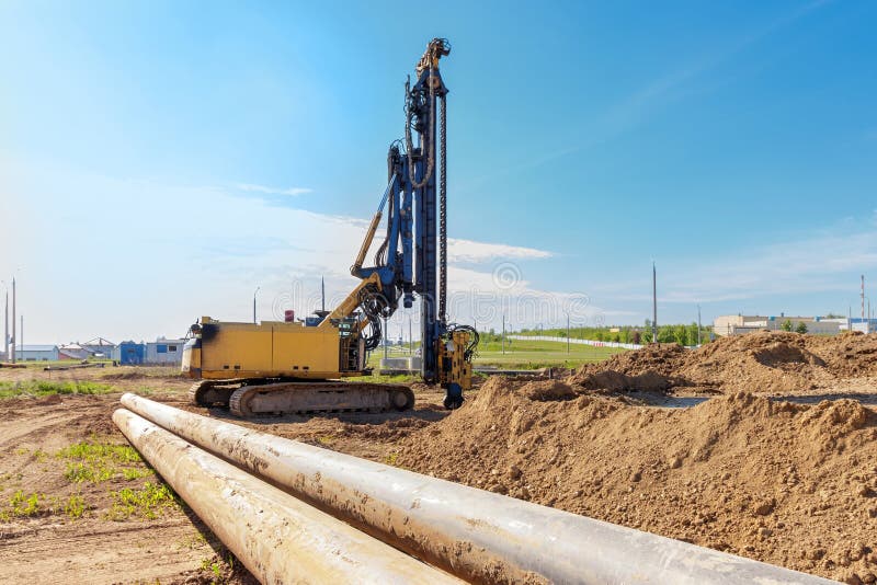 Drilling Machine on a Construction Site with Large Pipes Stock Photo ...