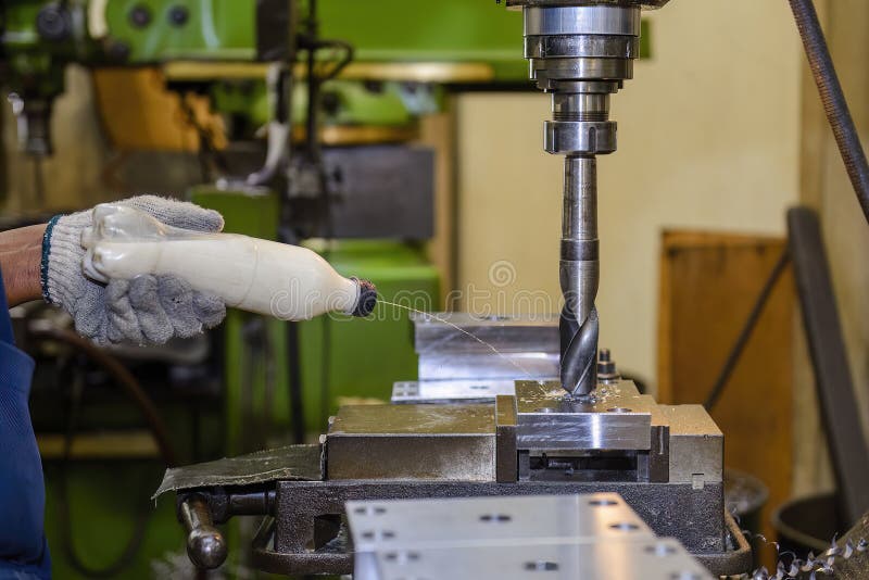 The Drilling Process on NC Milling Machine with Liquid Lubricant Stock ...