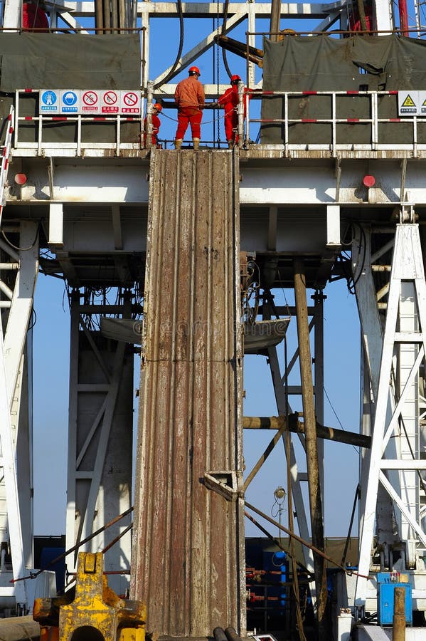 Oil Drilling Rig in a Hay Field Stock Photo - Image of drilling, field ...