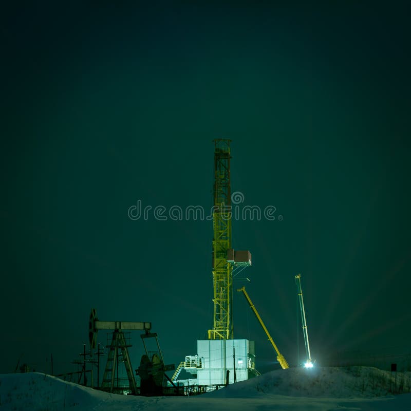 Drilling rig at night. stock photo. Image of fuel, power - 70392150