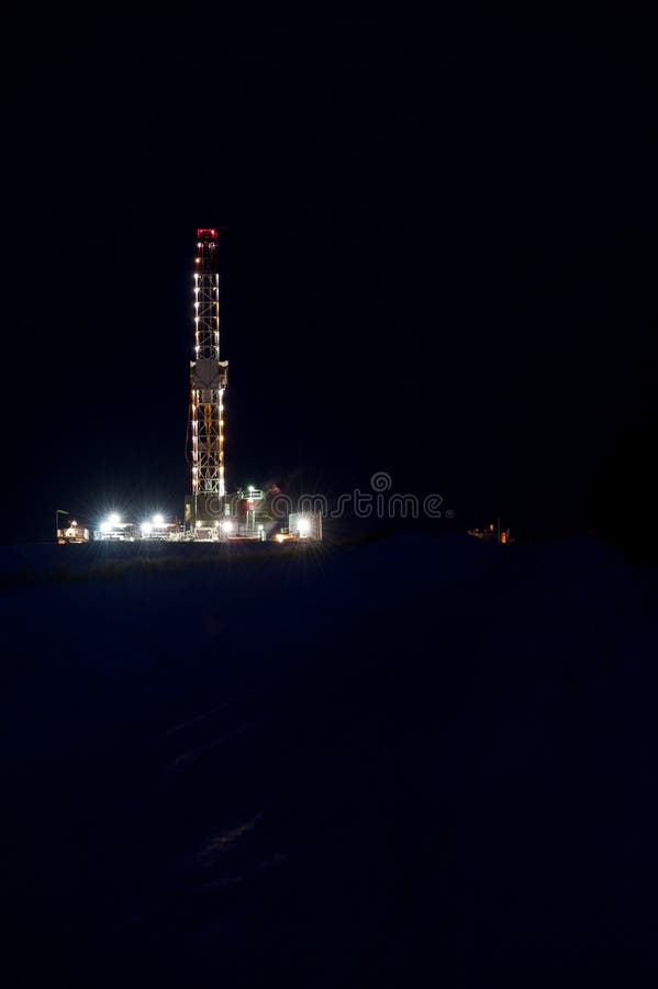 Drilling rig at night stock image. Image of compressor - 5921701