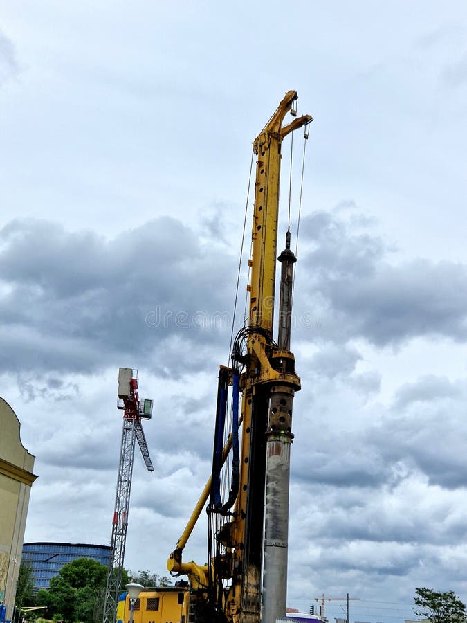 The Drilling Rig with a Pipe Drill Drills Holes for Concreting the ...