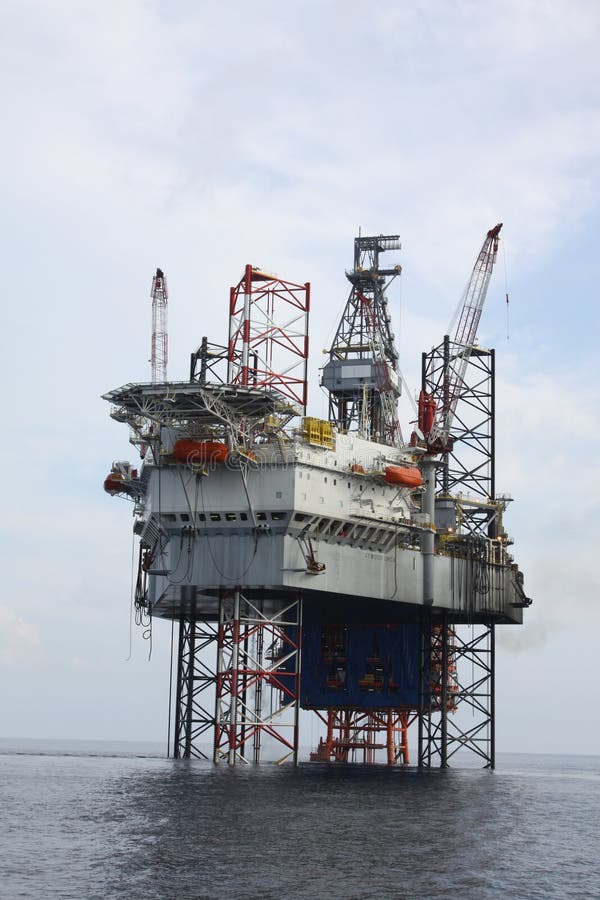Drilling rig at the sea. stock photo. Image of industrial - 63584360