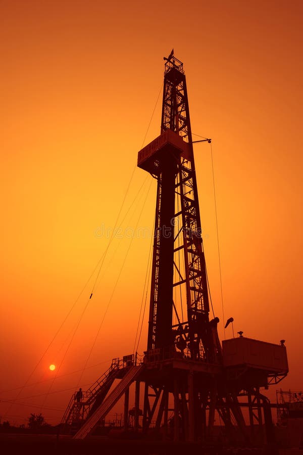 Drilling rig at sunset stock photo. Image of drill, night - 14423286
