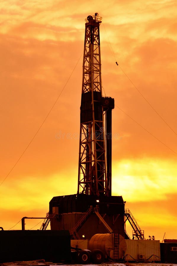 The Drilling Rig during Sunset Stock Photo - Image of field, sunrise ...