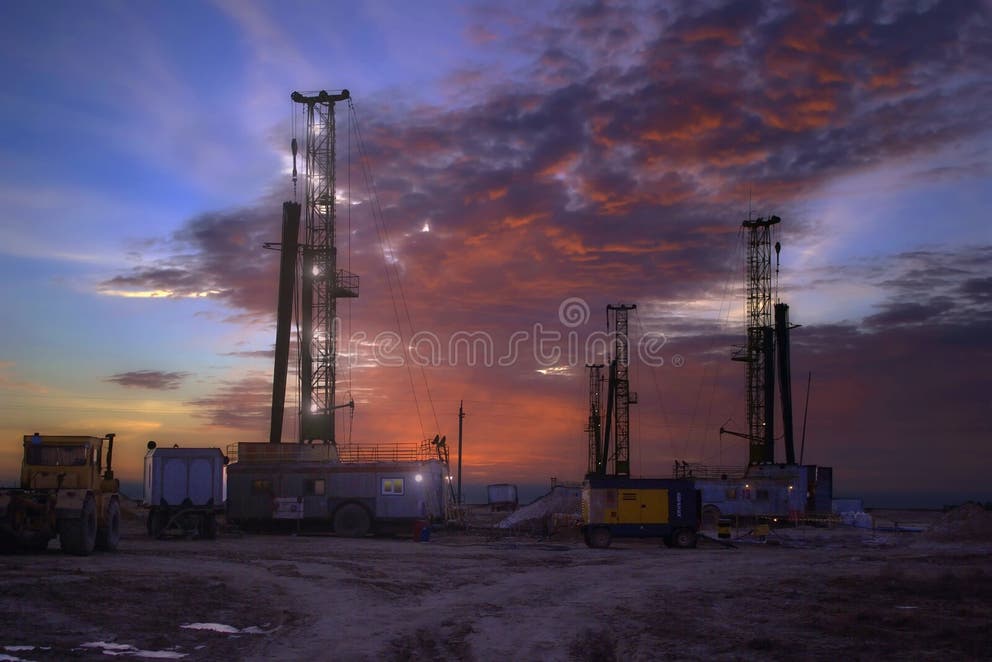 Drilling rigs at daybreak stock photo. Image of morning - 47643020