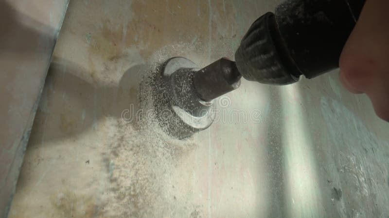 Drilling a Round Hole for Socket on Gray Concrete Wall. Round Nozzle ...