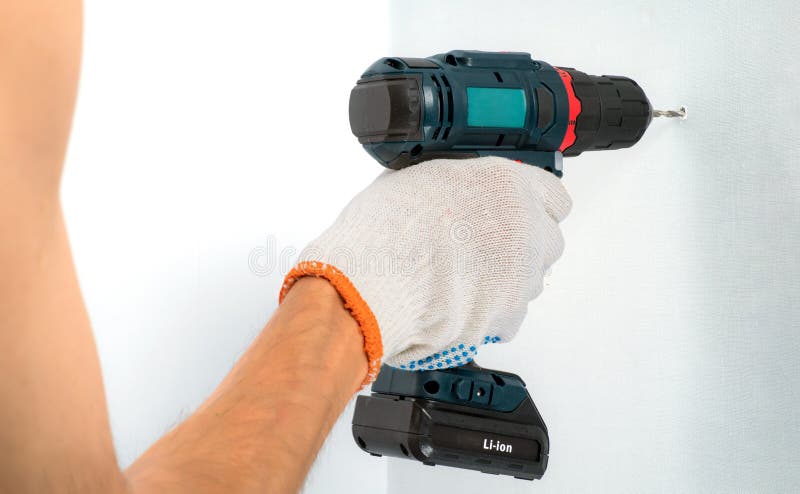 Drilling the Wall with a Cordless Drill Stock Image - Image of home ...