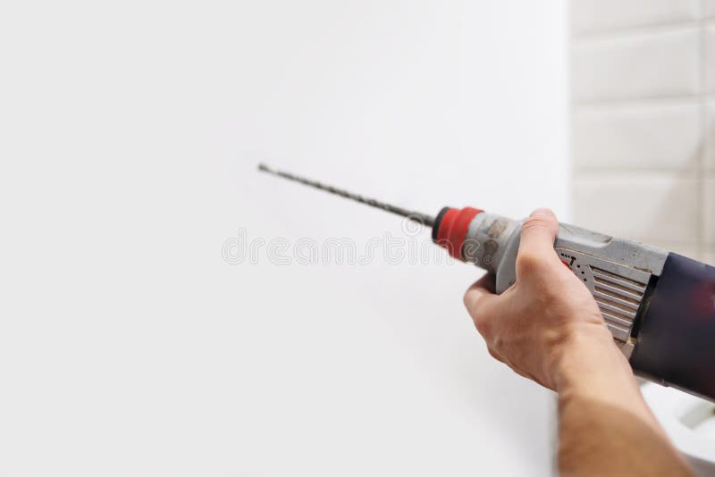 Drilling a White Wall with a Drill Close-up. Stock Image - Image of ...