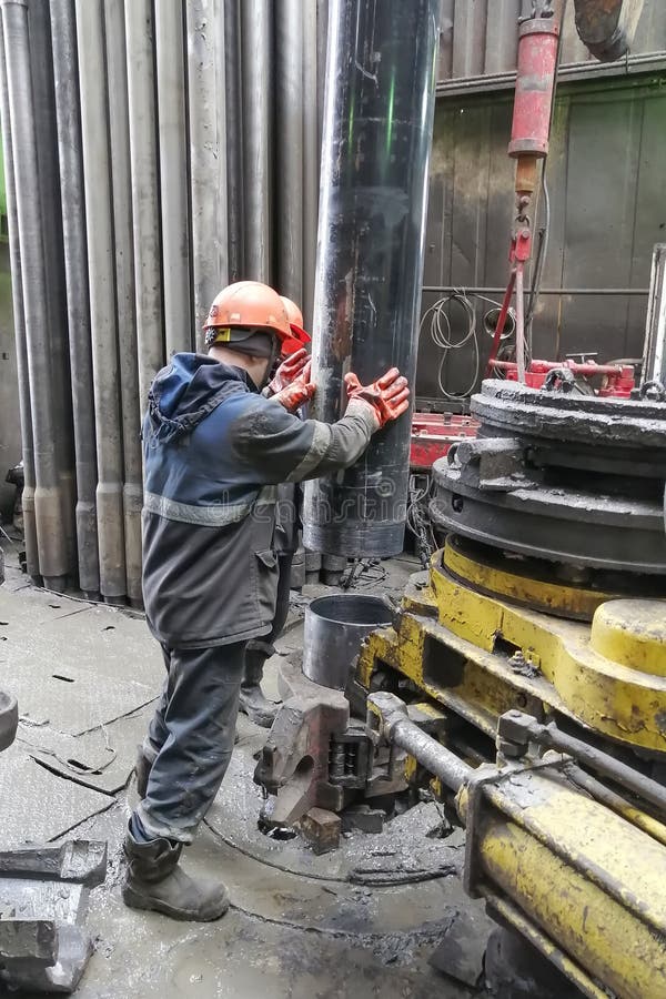 Drilling Rig and Two Oil Workers Stock Image - Image of hardwork, glove ...