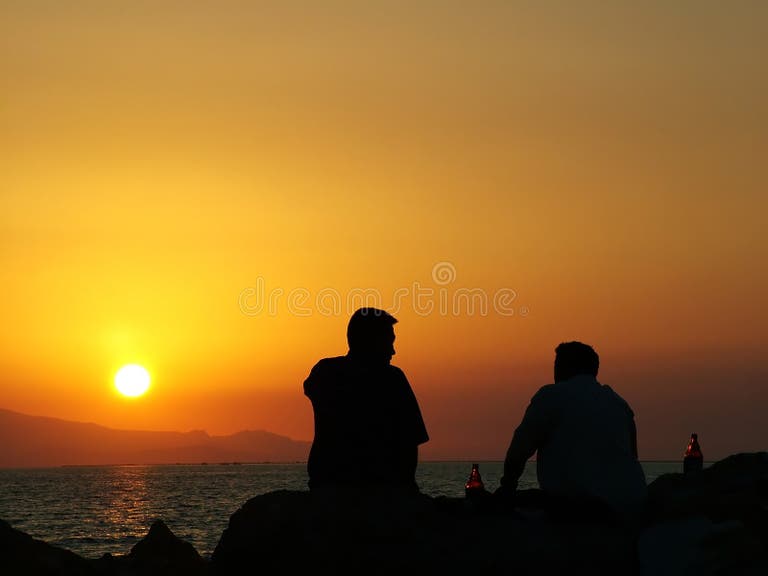 Drink beer at sunset stock photo. Image of cheerio, drinking - 561180