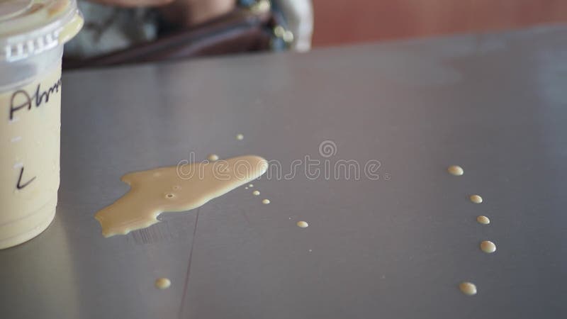 A Drink Has Unfortunately Spilled Onto a Flat Surface of a Table ...