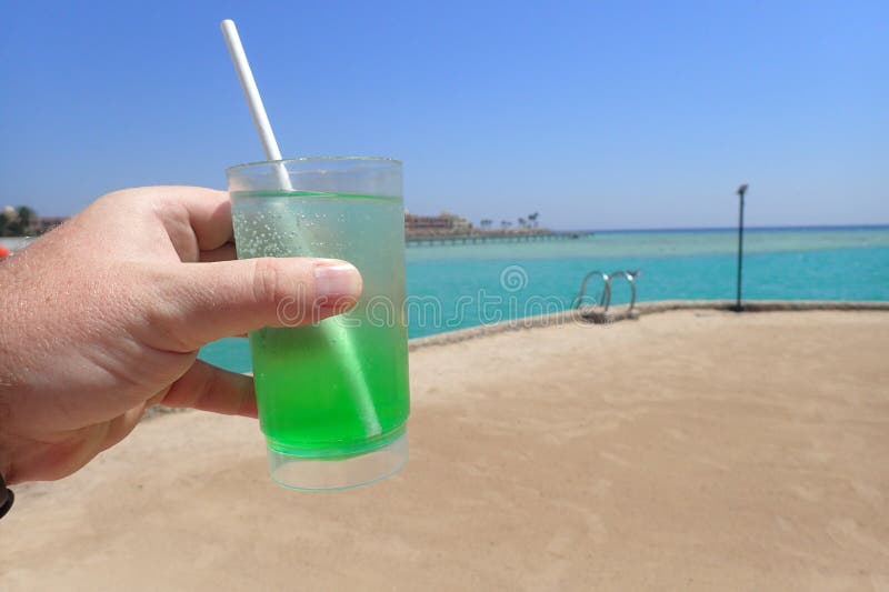 Drink in the Plastic Pot on the Beach Stock Image - Image of bottle ...