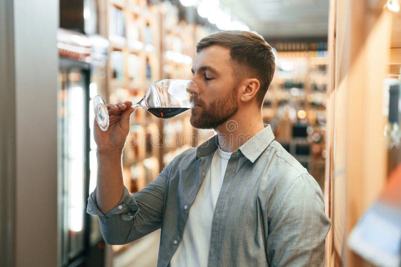 Drink Tasting. Man is Choosing Wine in the Store Stock Image - Image of ...