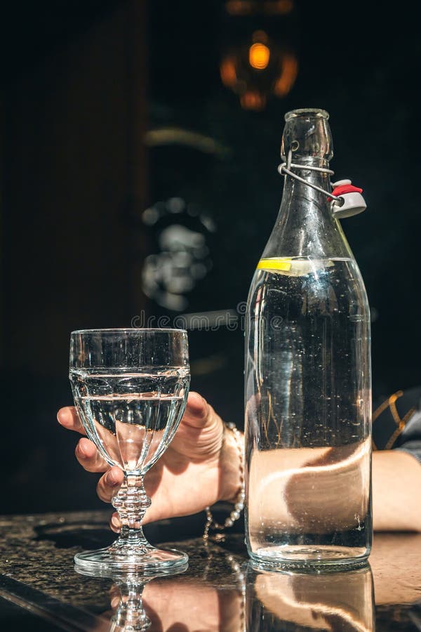 Drink Water Bottle with Glass on Table in the Restaurant. Stock Image ...